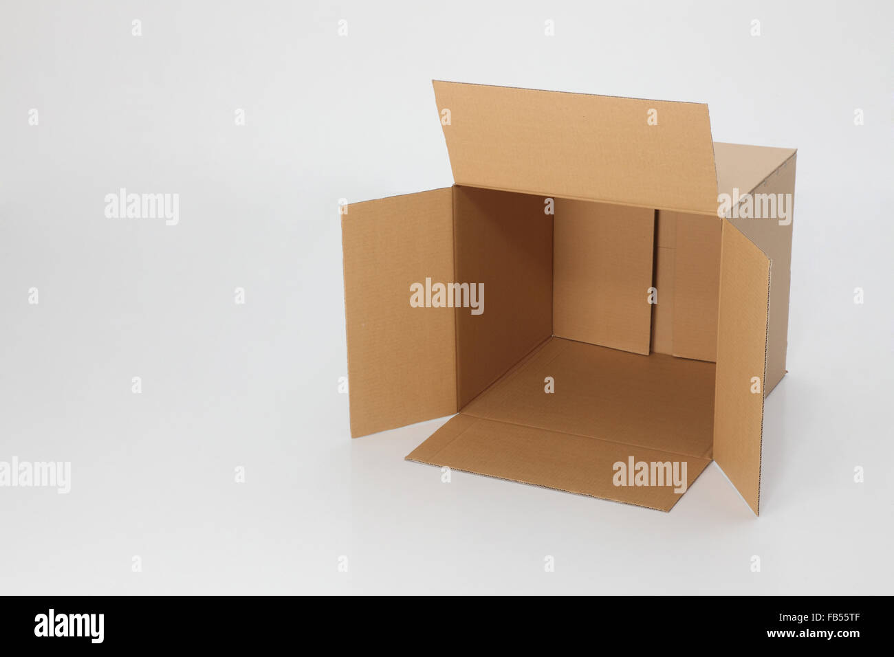 empty brown cardbox open on the plain background Stock Photo - Alamy