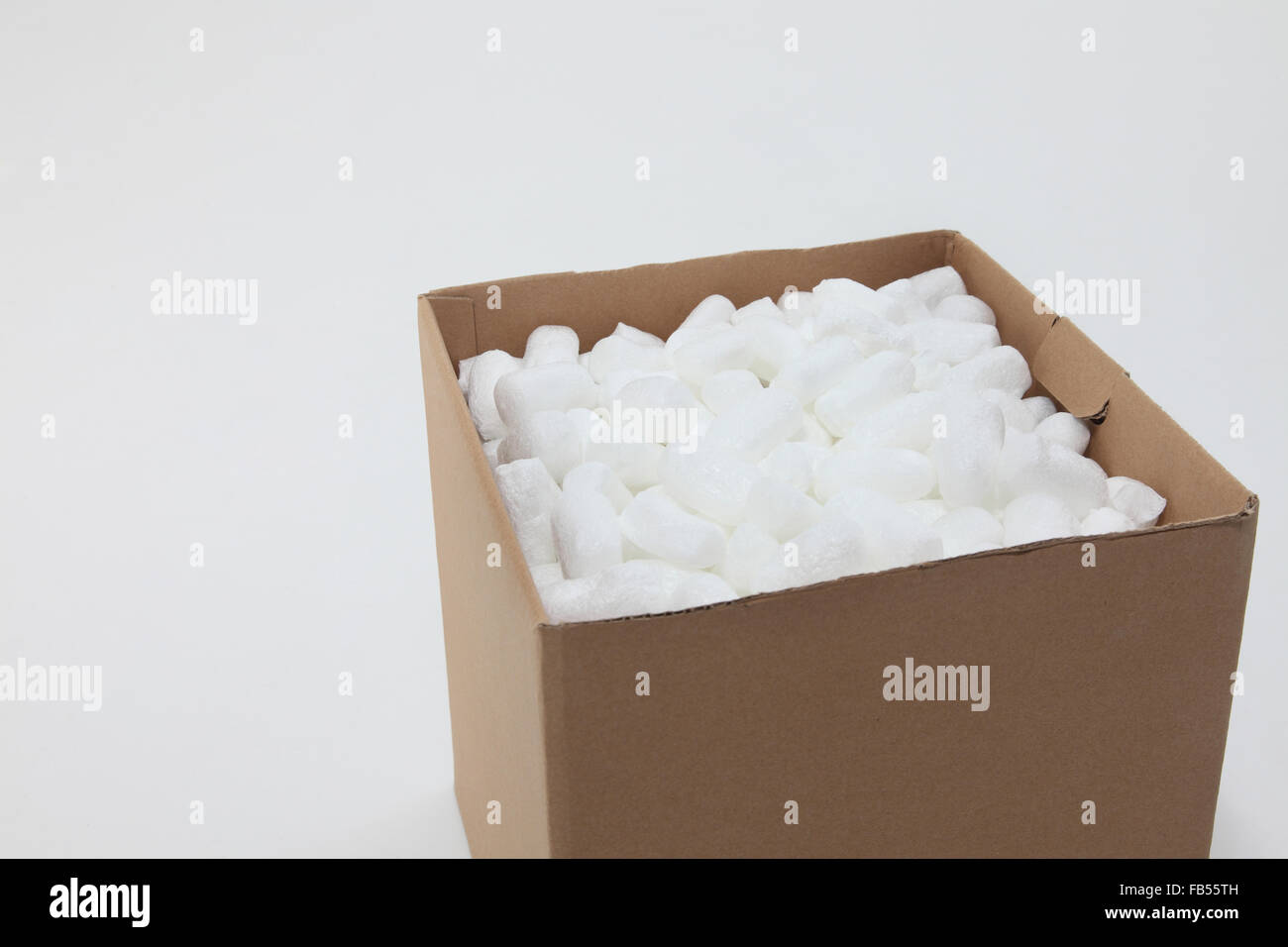 open box with packing 'peanuts' inside on the plain background Stock ...