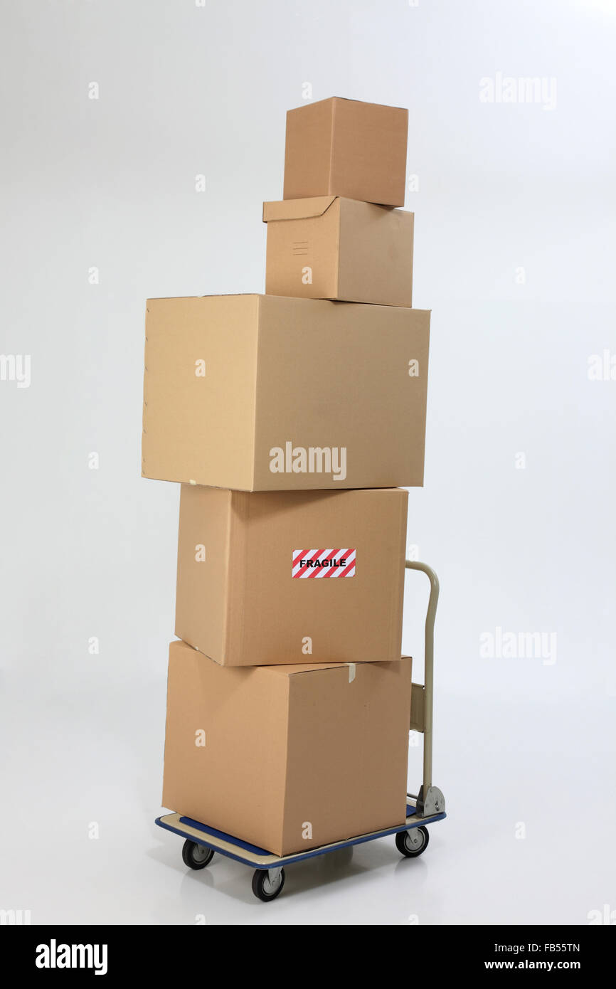 boxes stack up on top of trolley Stock Photo - Alamy