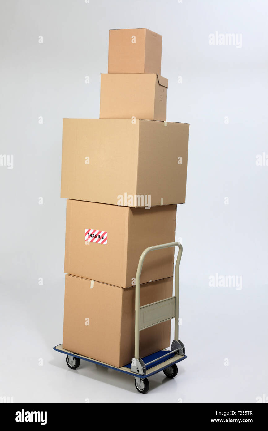 boxes stack up on top of trolley Stock Photo - Alamy