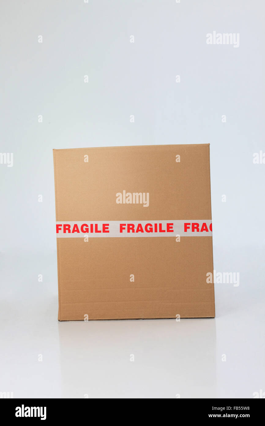 brown cardboard box sealed with fragile sign Stock Photo - Alamy