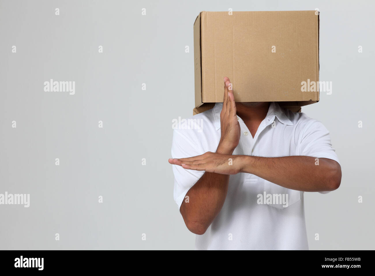 Man with a carton box on head Stock Photo - Alamy