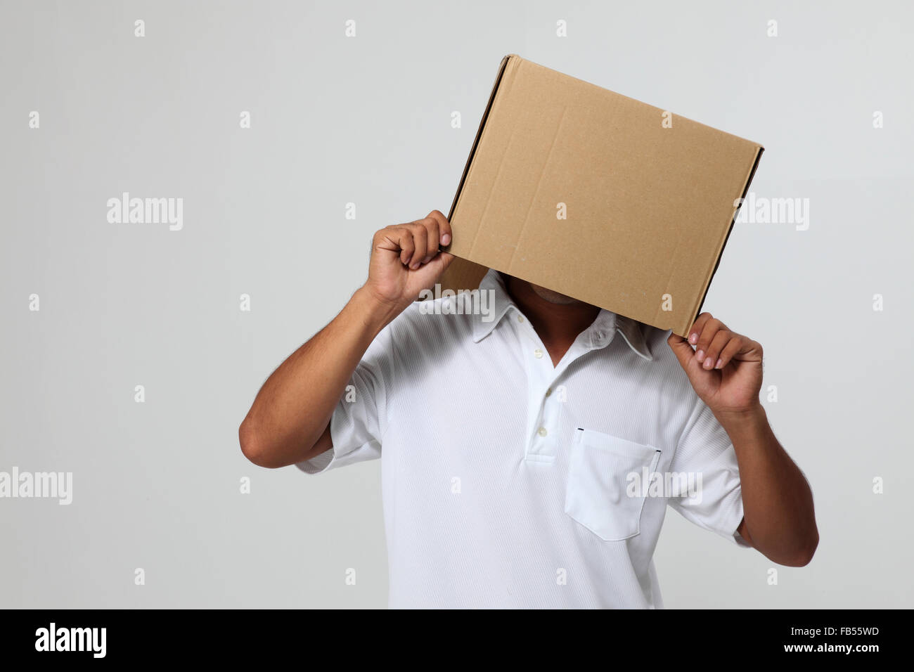Man with a carton box on head Stock Photo - Alamy