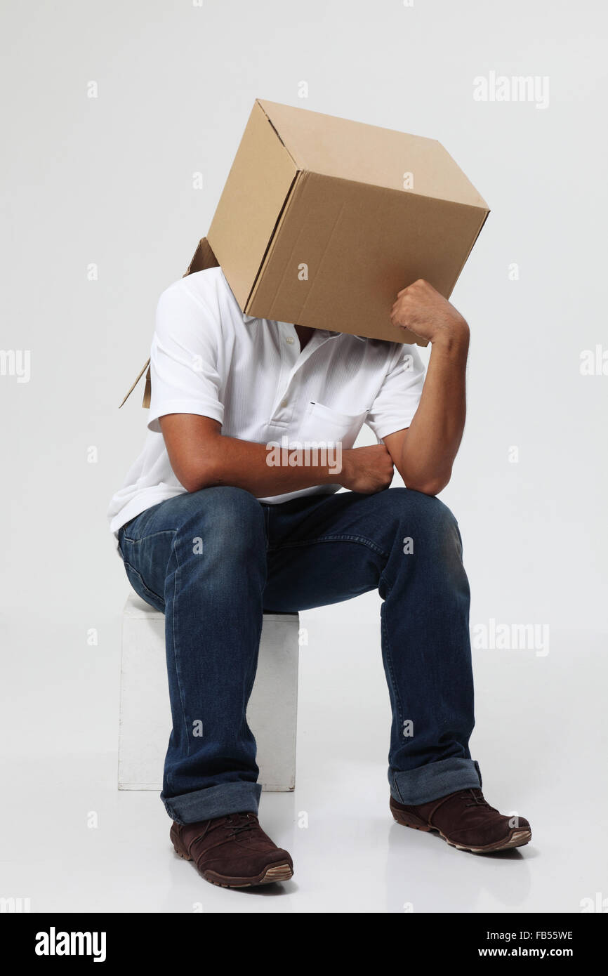 Man with a carton box on head Stock Photo - Alamy