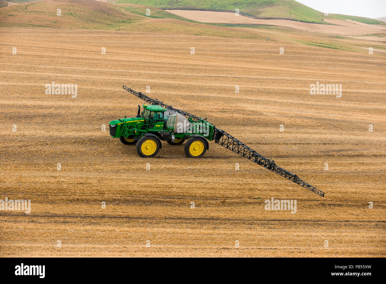 John Deere self propelled sprayer spraying herbicide on a field in ...