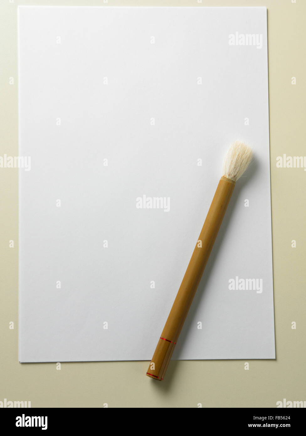 brush and paper . Traditional calligraphy set on a bamboo mat Stock ...