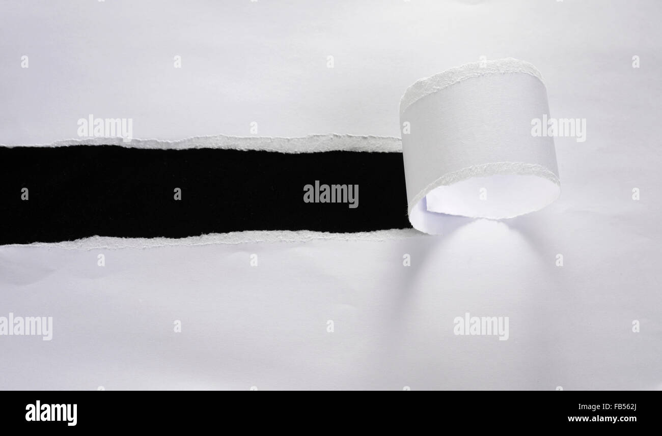 torn or tearing paper into two pieces Stock Photo - Alamy