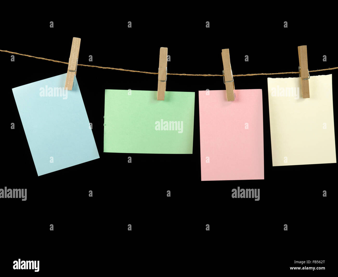 washing line clipped with different type size of paper Stock Photo - Alamy