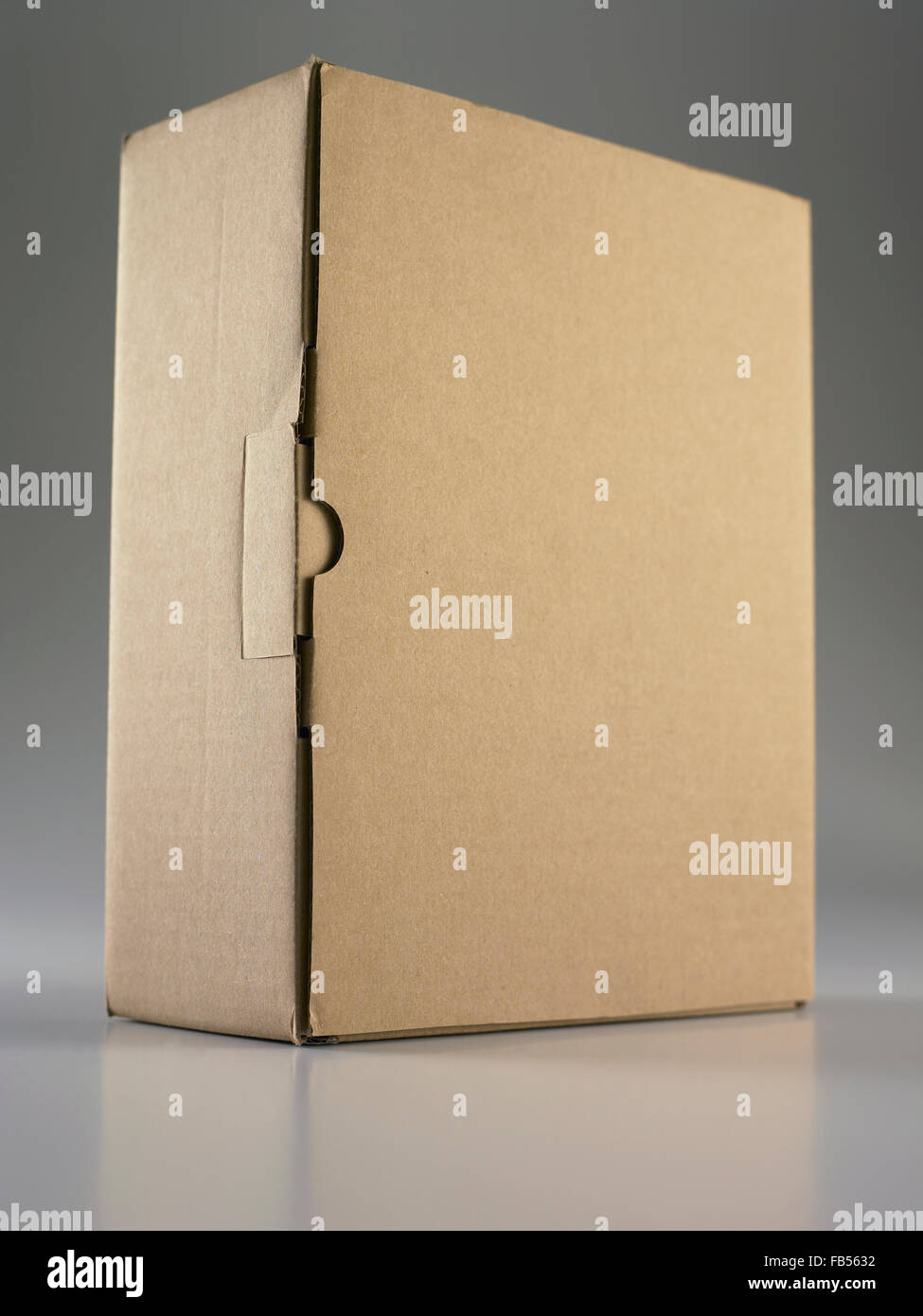 browm color cardboard box on the plain background Stock Photo - Alamy