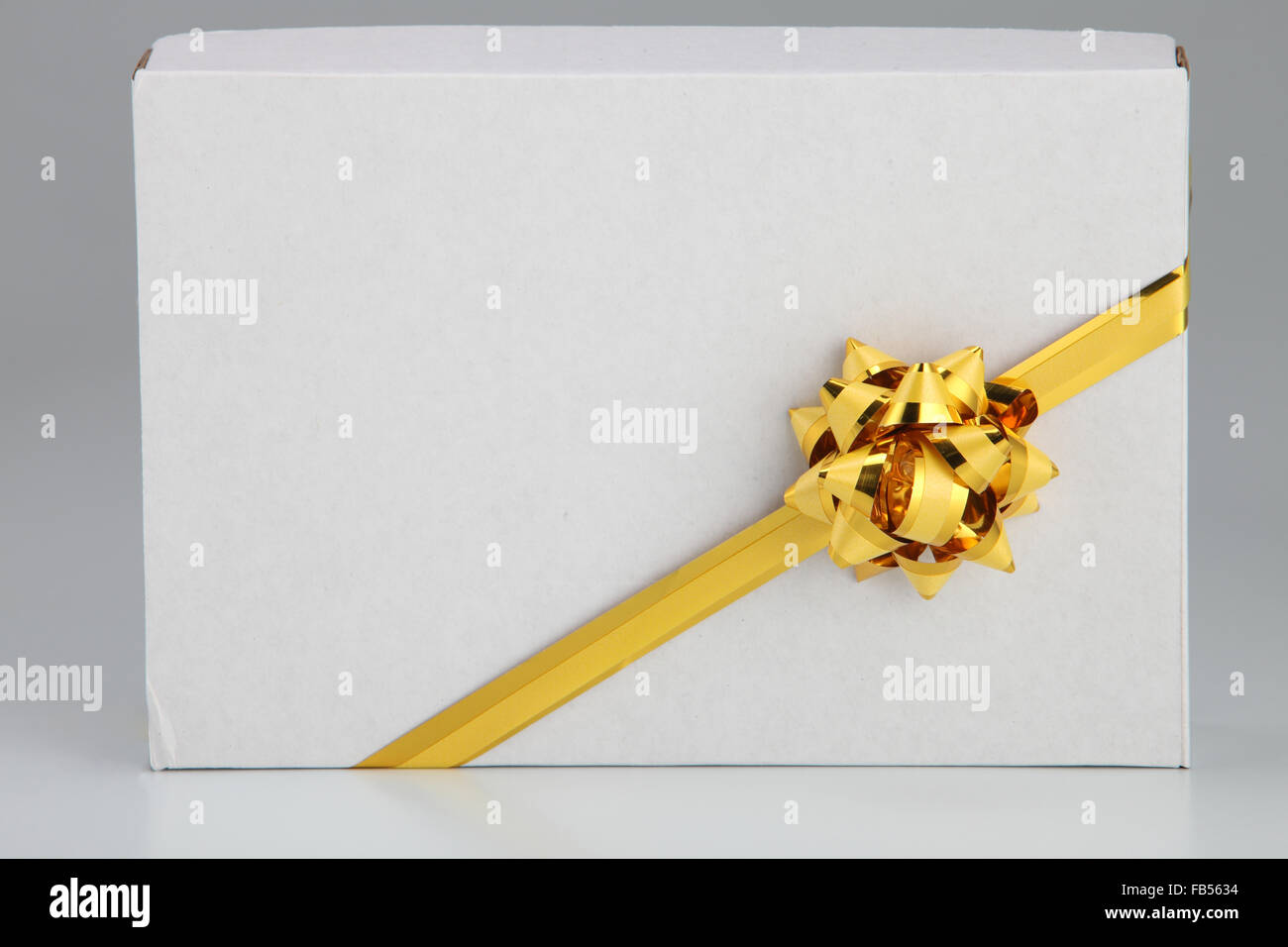 yellow ribbon on the white box Stock Photo - Alamy