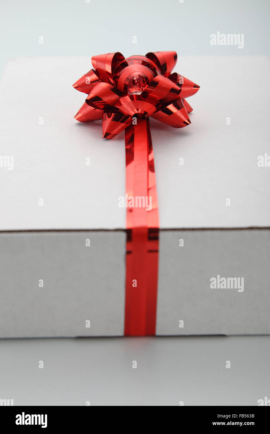red ribbon on the white box Stock Photo - Alamy