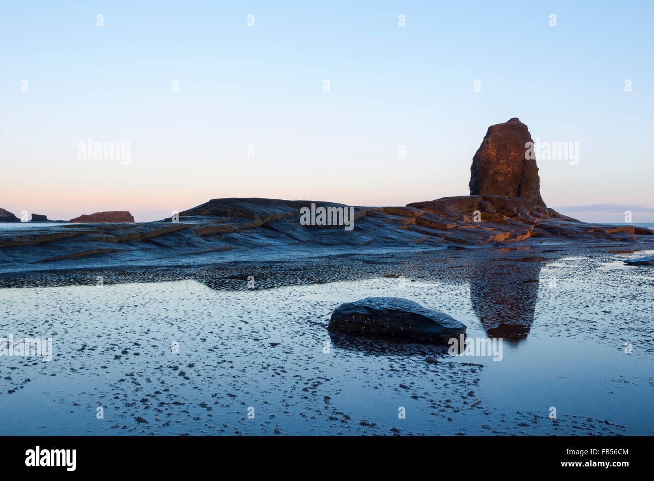 Black Nab at Saltwick Bay near Whitby at daybreak with Saltwick Nab in ...