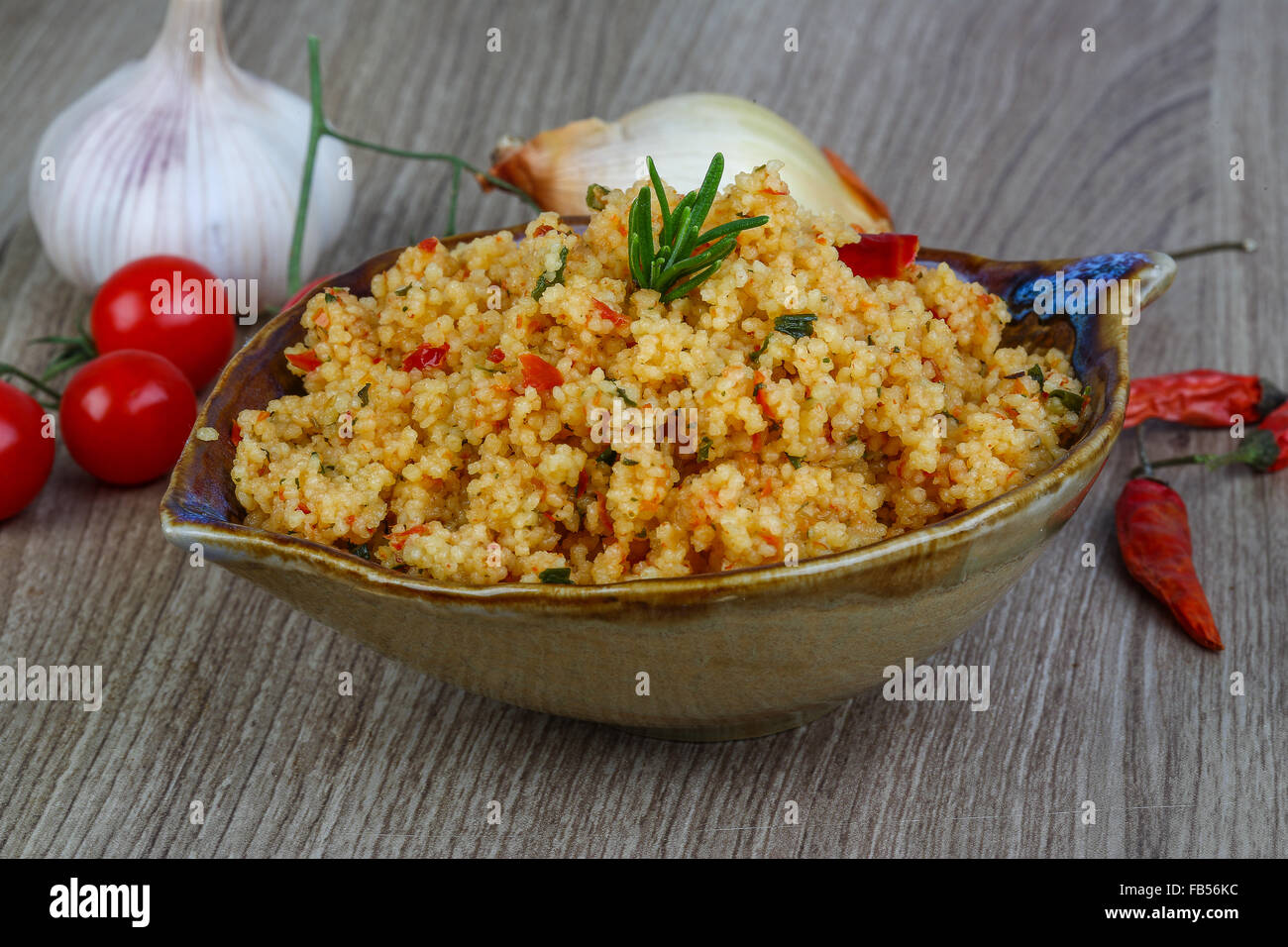 Arabic traditional cuisine - Couscous with tomato and green onion Stock ...