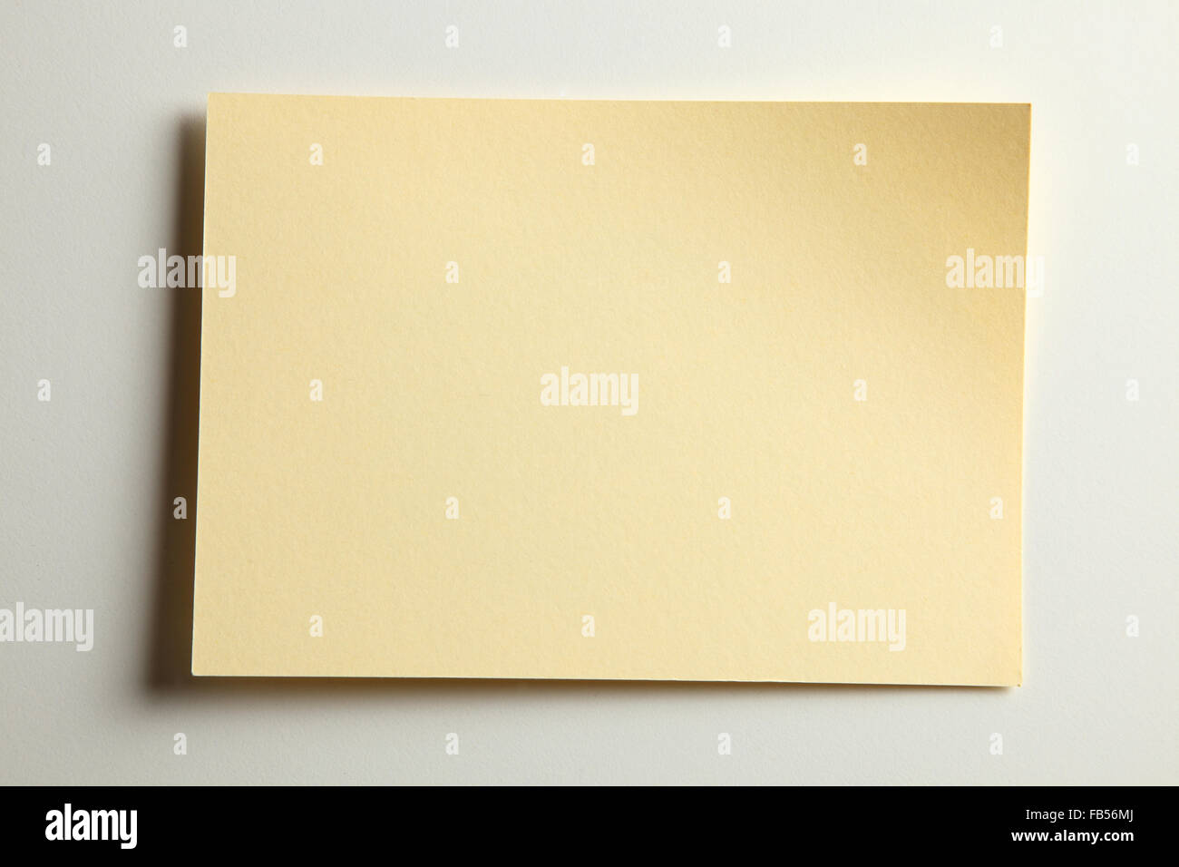 blank yellow texture note on the plain background Stock Photo - Alamy