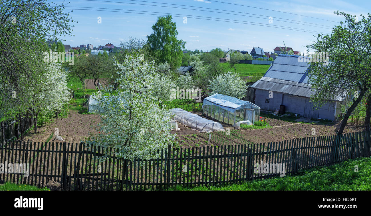 Spring village landscape. Garden Stock Photo - Alamy