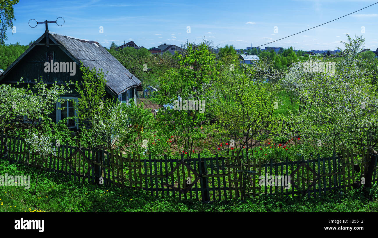 Spring village landscape. Garden Stock Photo - Alamy