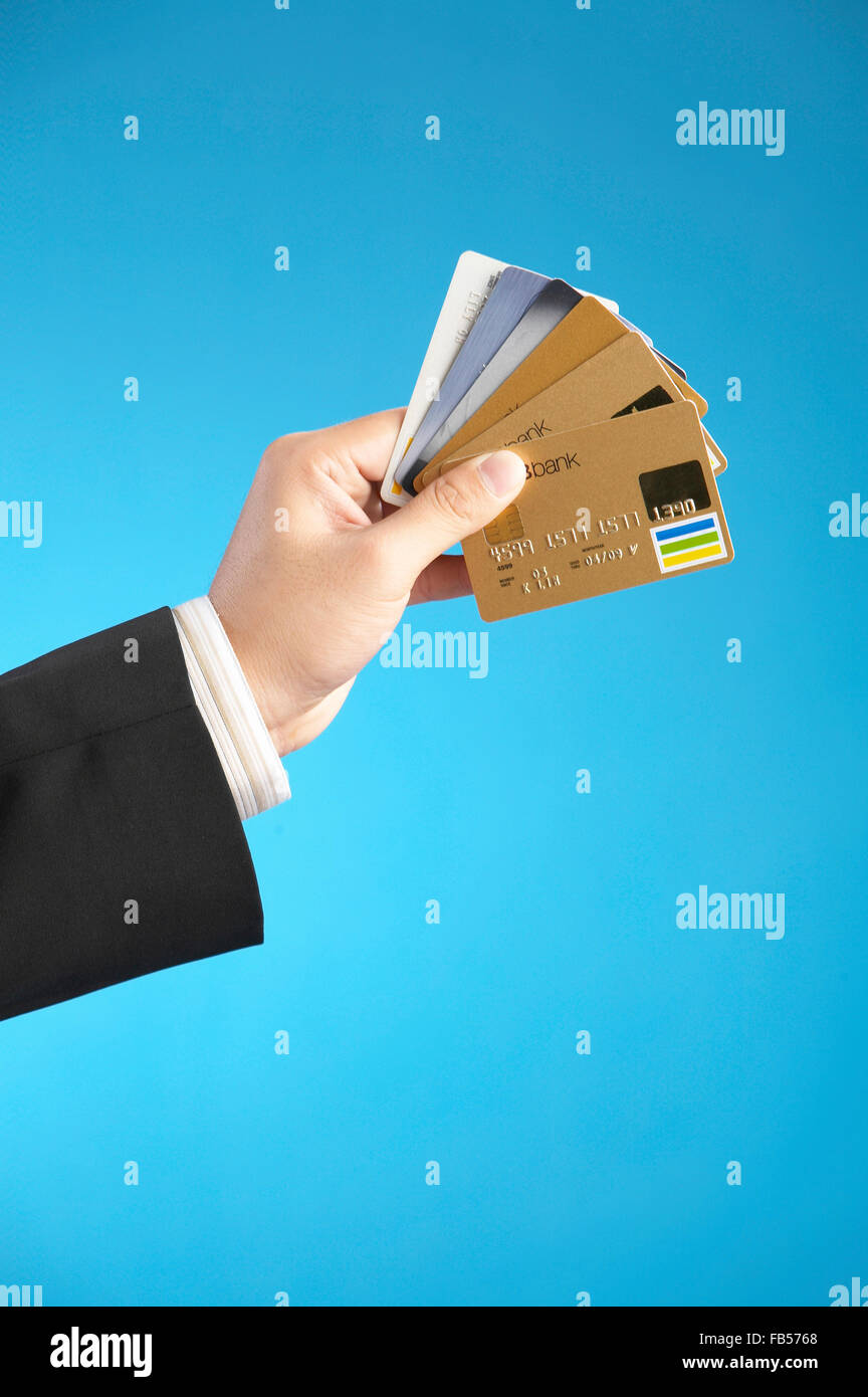 man holding numberous credit cards Stock Photo - Alamy