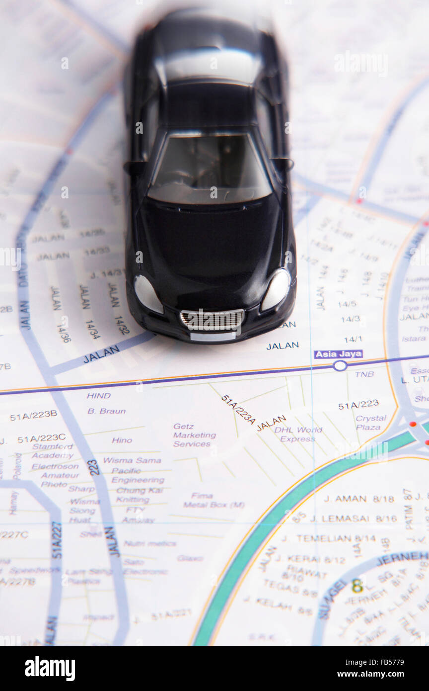 concept shot of car on the map Stock Photo - Alamy