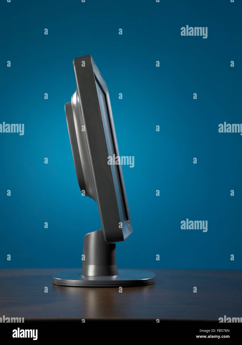 a side view of a monitor on ht office table Stock Photo - Alamy