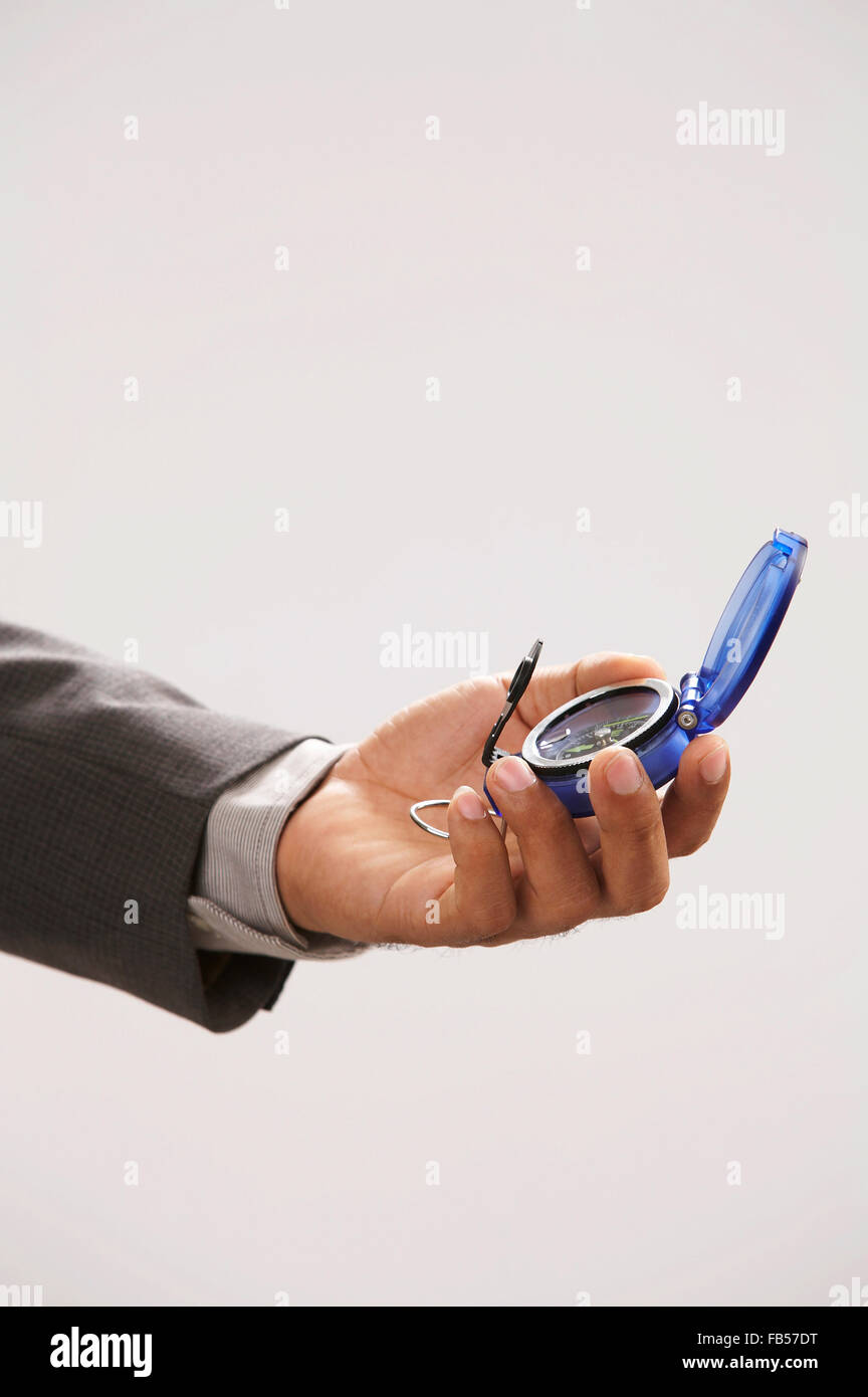 man holding compass finding a right direction Stock Photo - Alamy