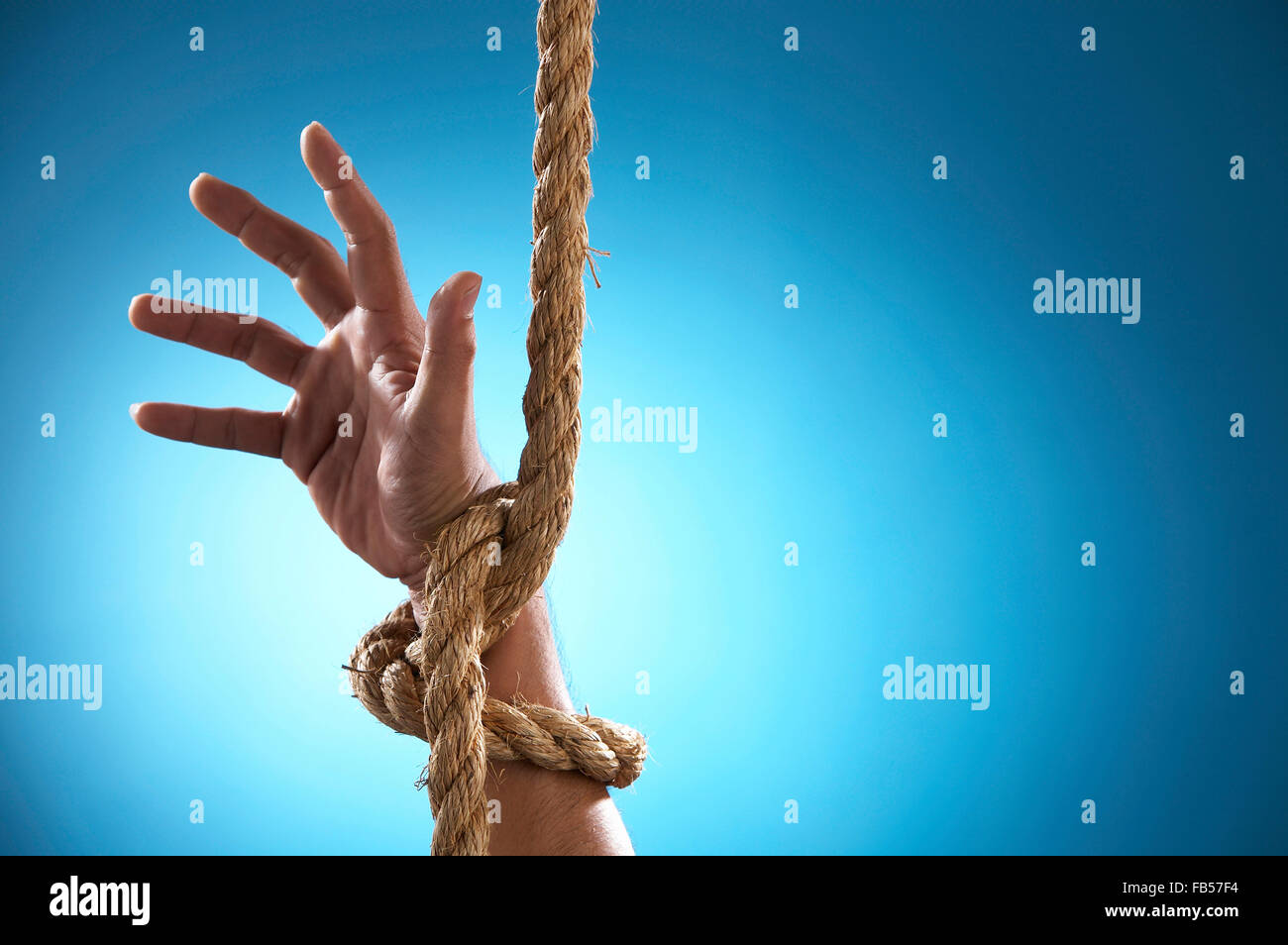 Tied hands asking help hi-res stock photography and images - Alamy