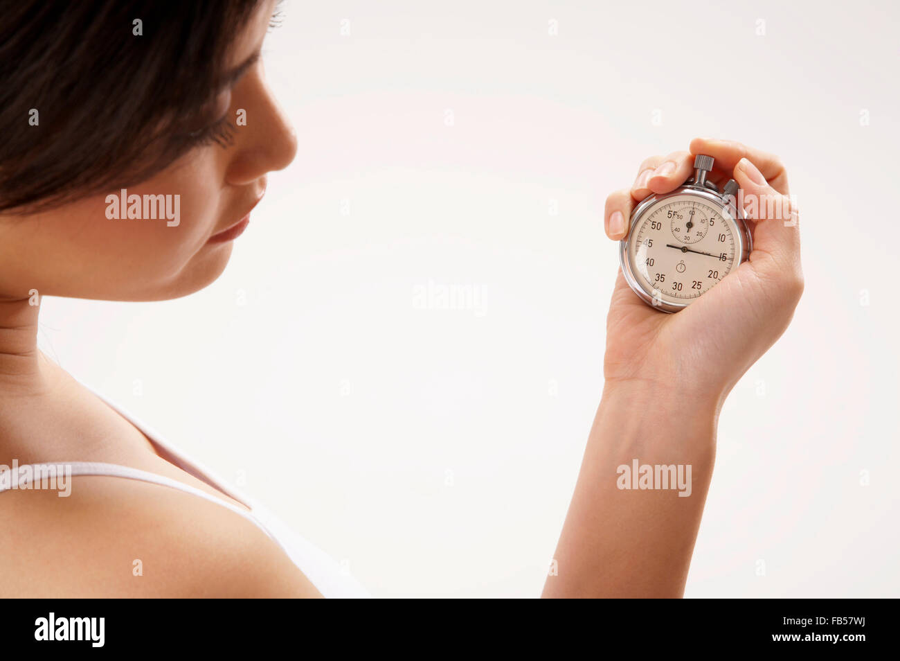 young woman holding a stop watch Stock Photo - Alamy