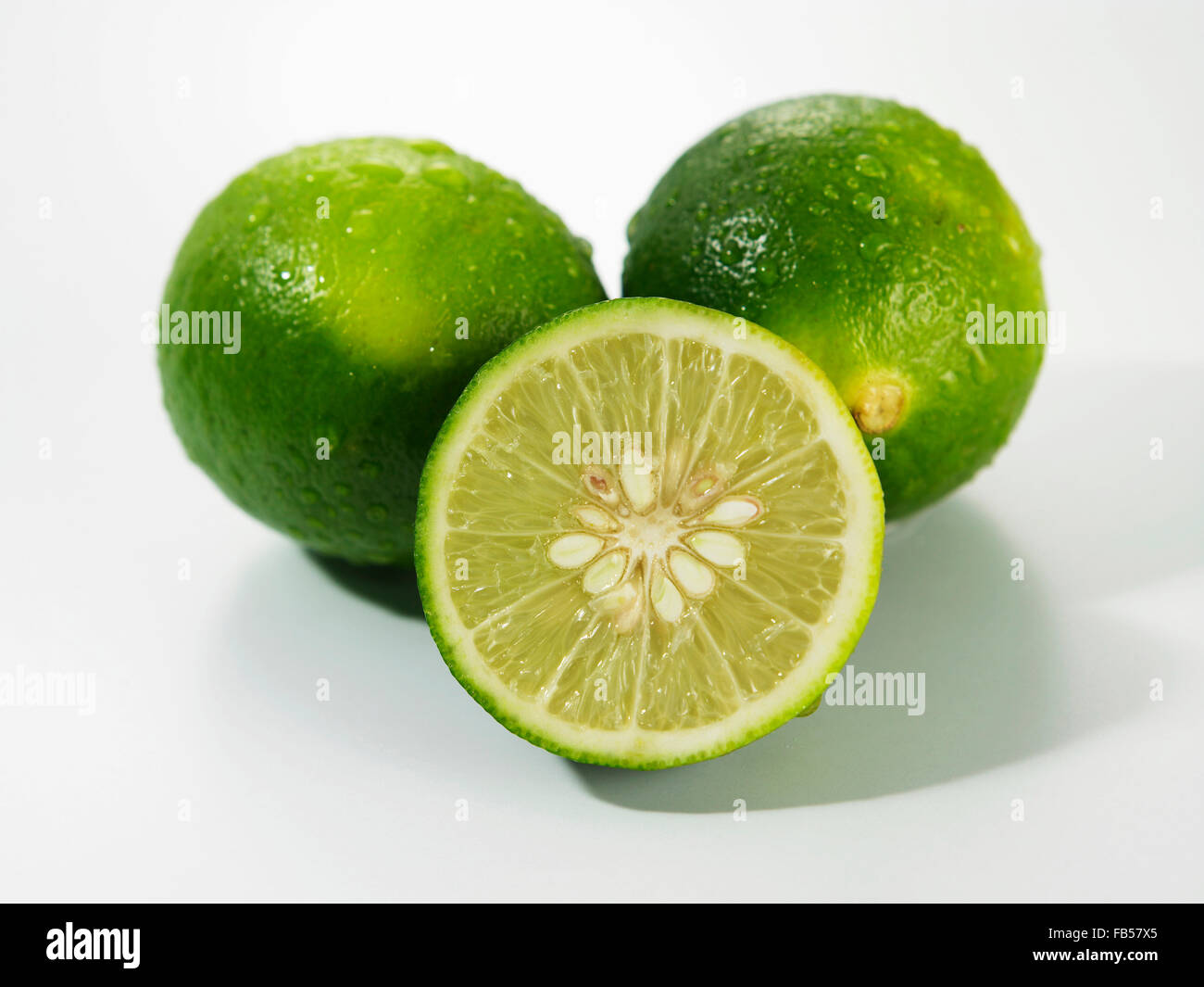 cut of limes on the white back ground Stock Photo - Alamy