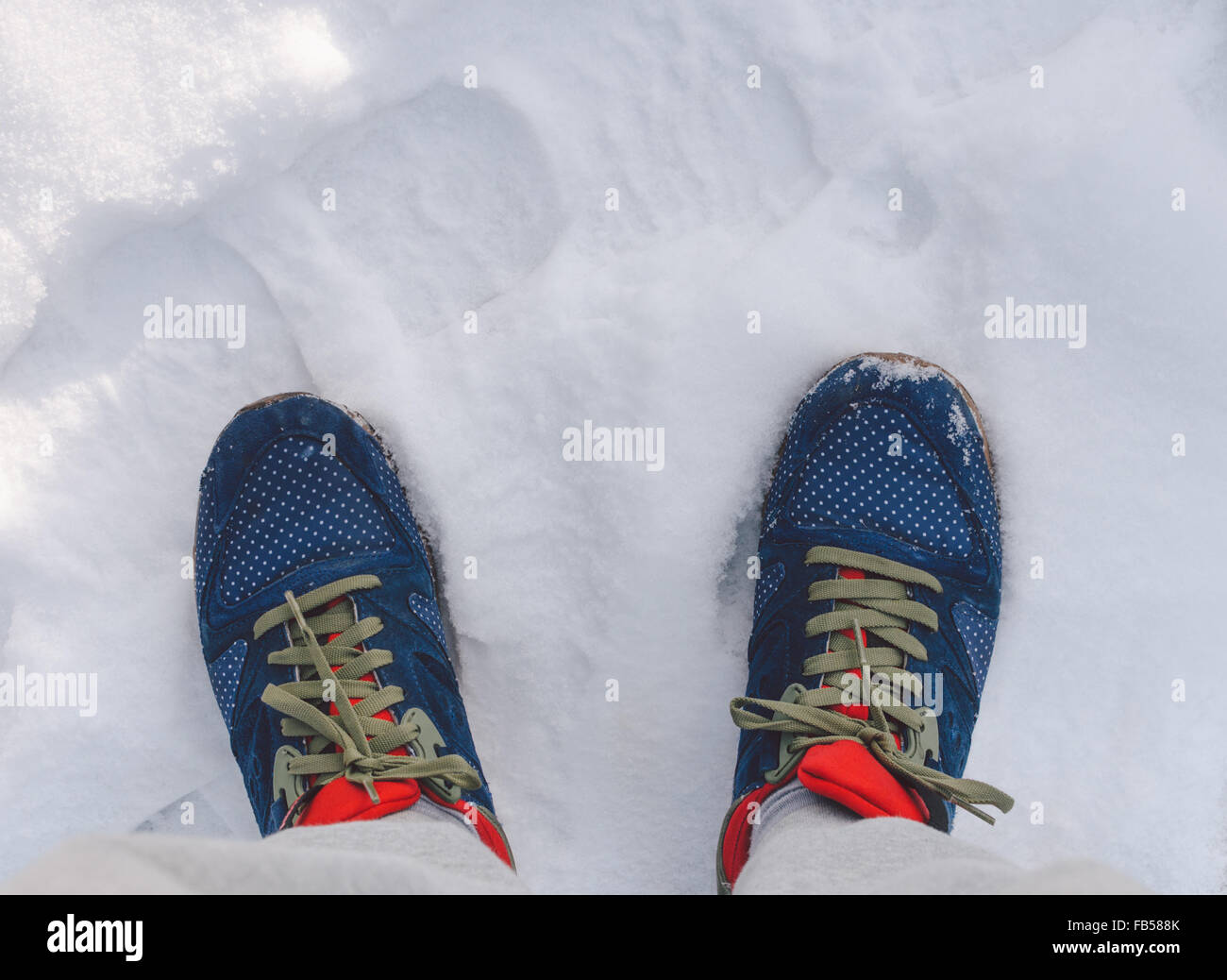 Woman walking in snow shoes hi-res stock photography and images - Alamy