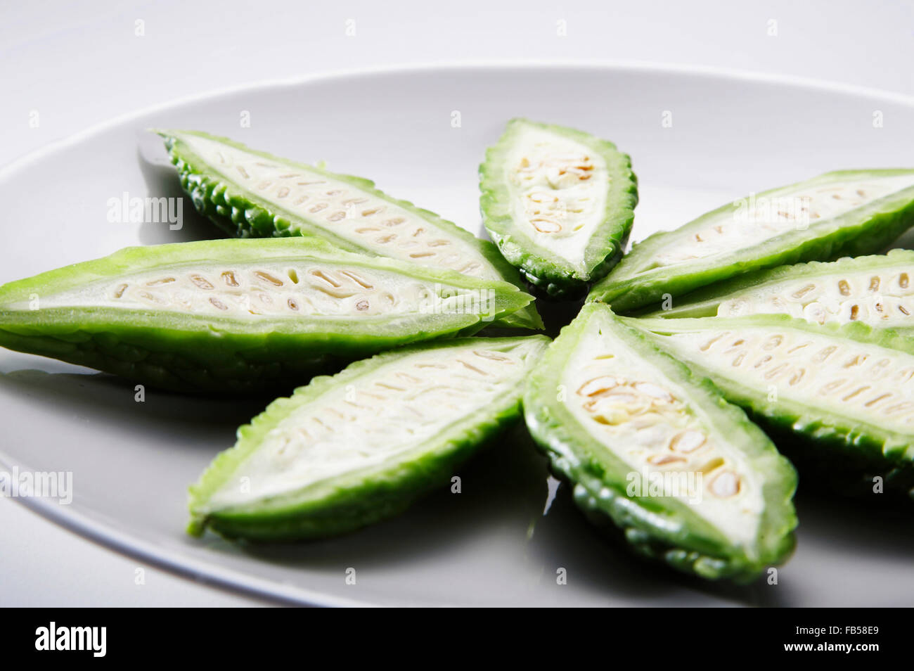 shot of bitter guard on the white background Stock Photo - Alamy