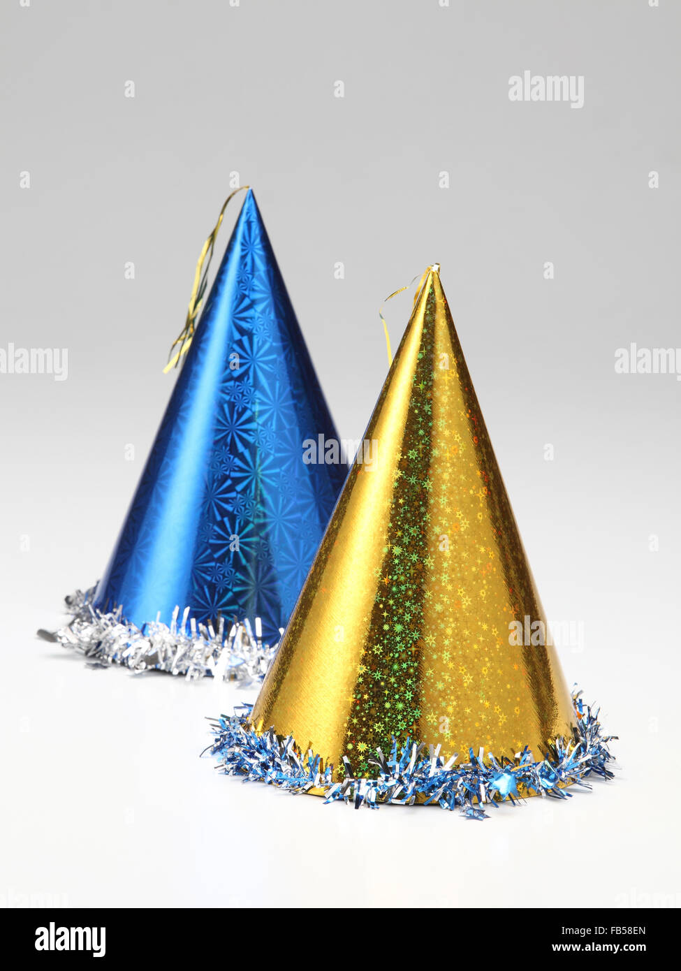 two party hats on the white background Stock Photo - Alamy