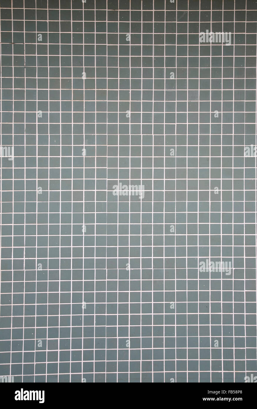 a wall of gray color of small checker tiles Stock Photo - Alamy