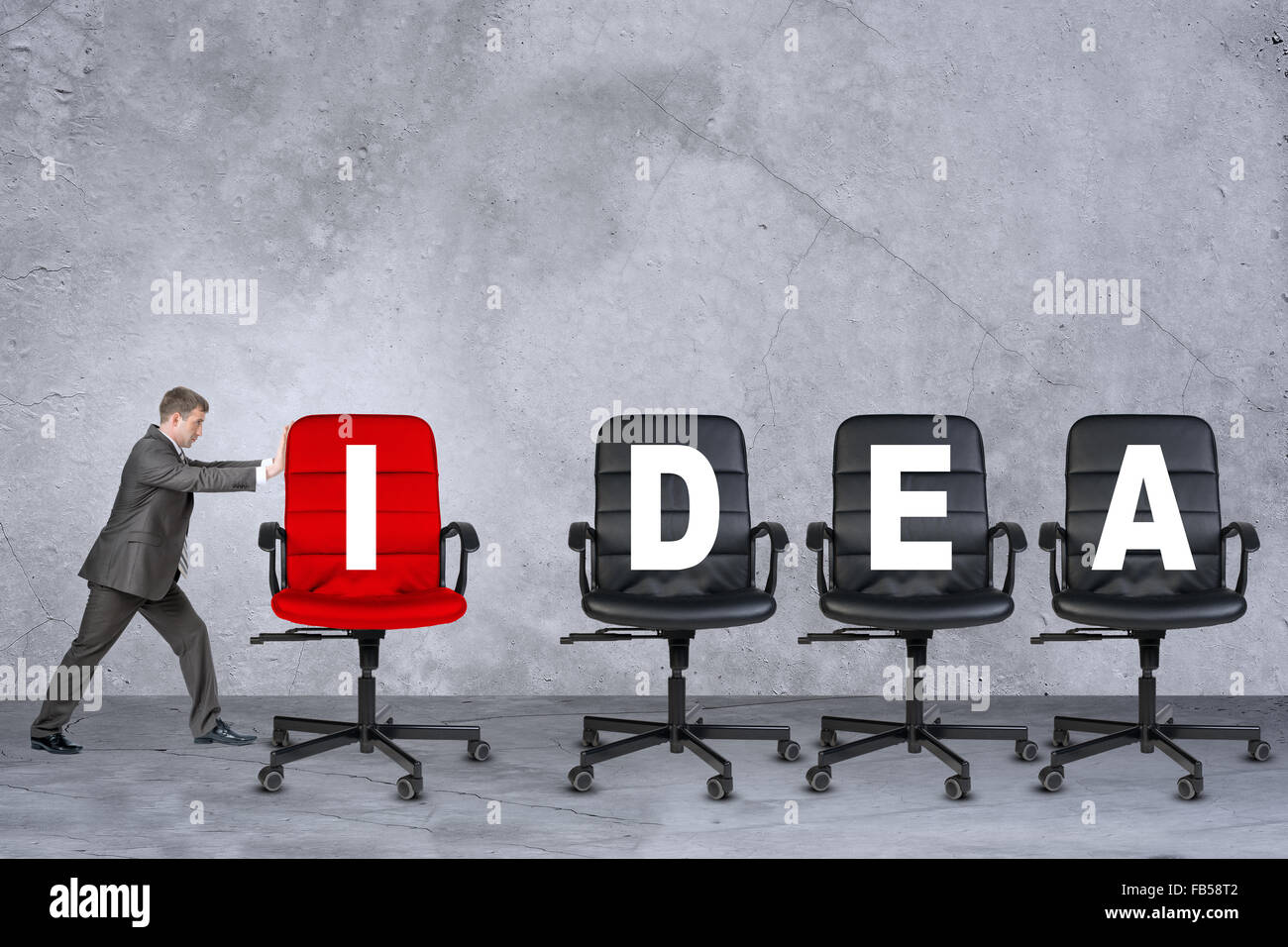 Young businessman pushing word idea Stock Photo - Alamy