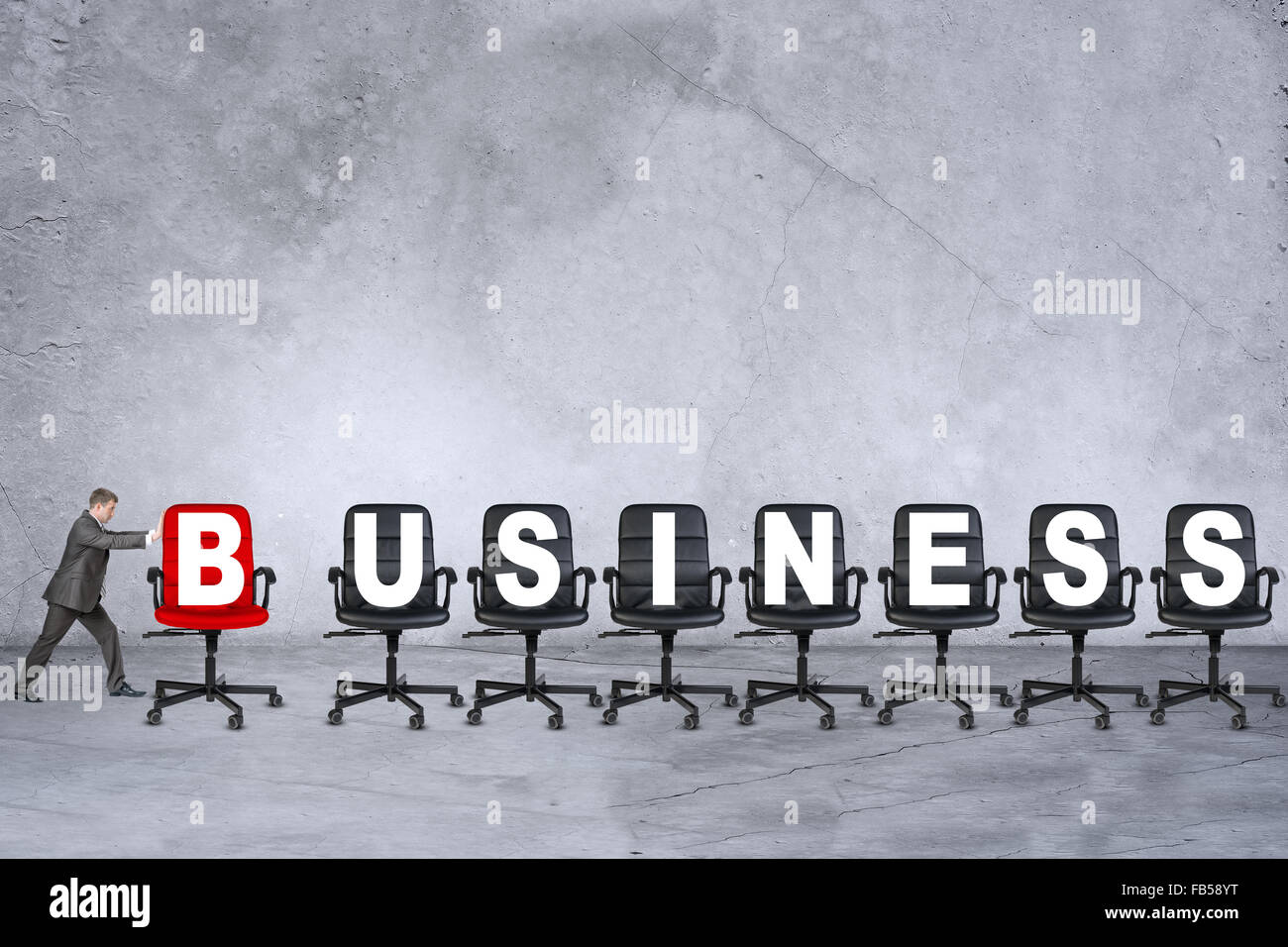 Young businessman pushing word business Stock Photo - Alamy