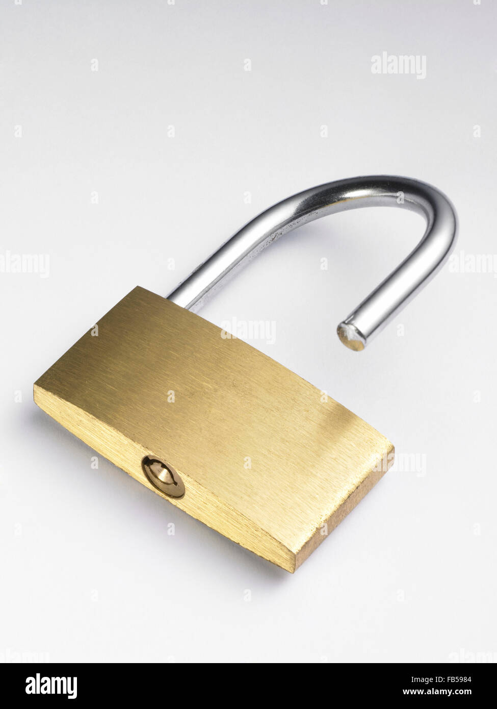 a unlock brass lock on the white background Stock Photo - Alamy