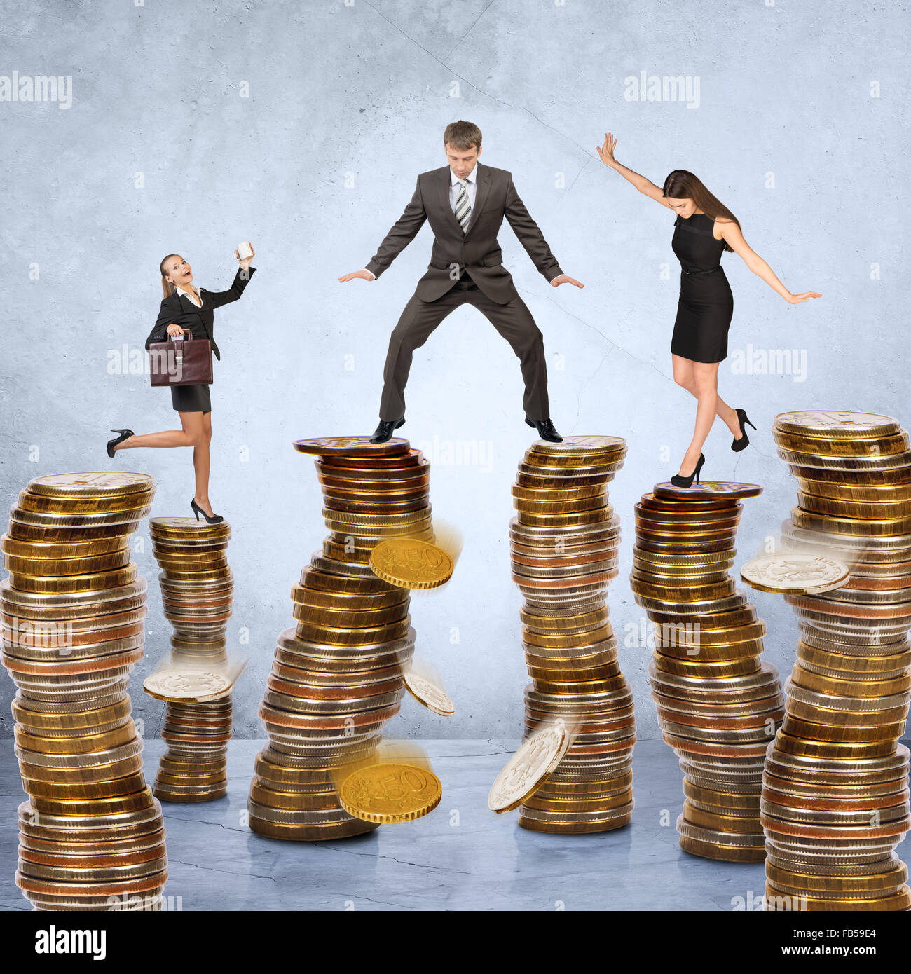 Business people standing on coins stack Stock Photo - Alamy