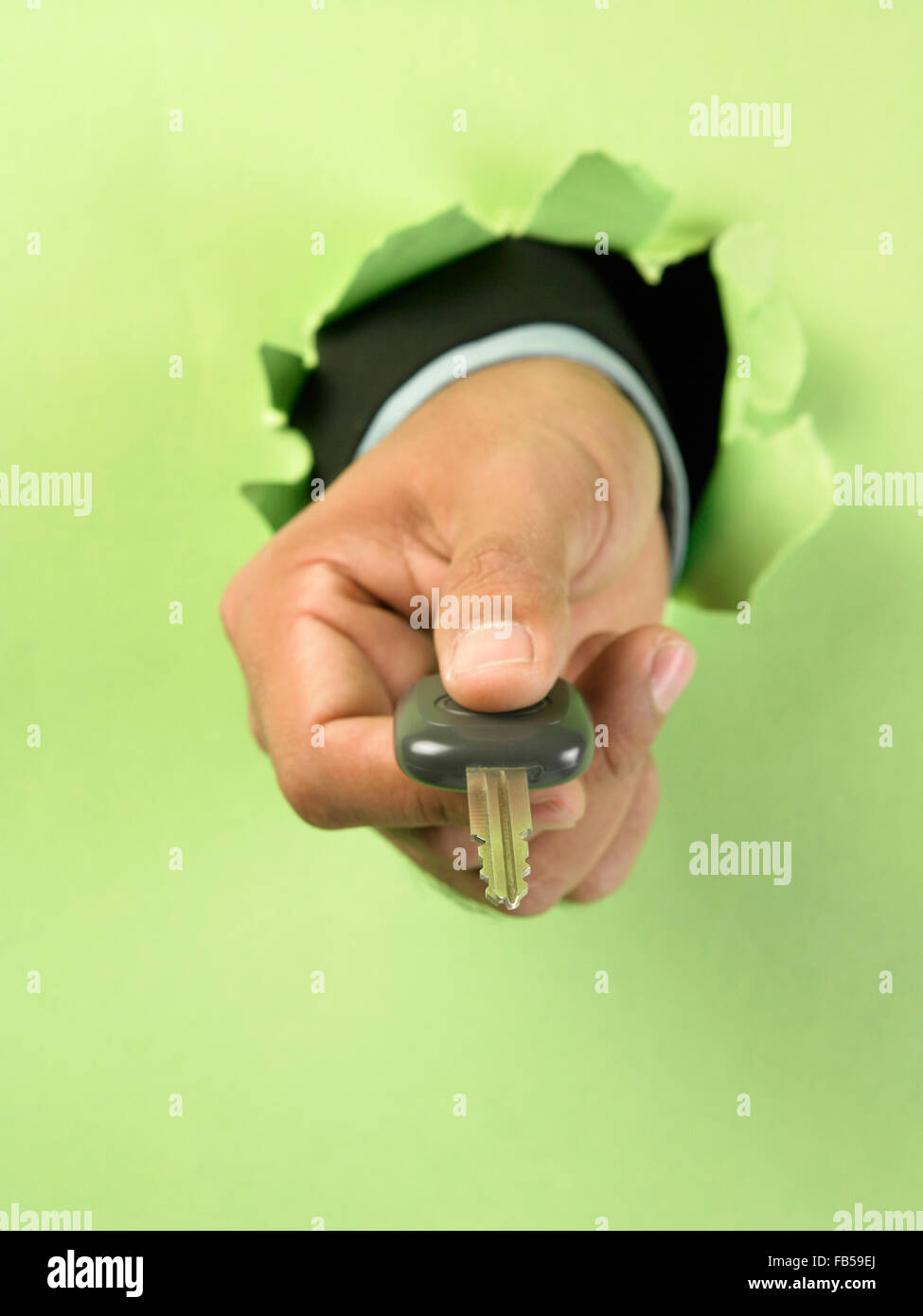 hand gesture break through green paper with action Stock Photo - Alamy