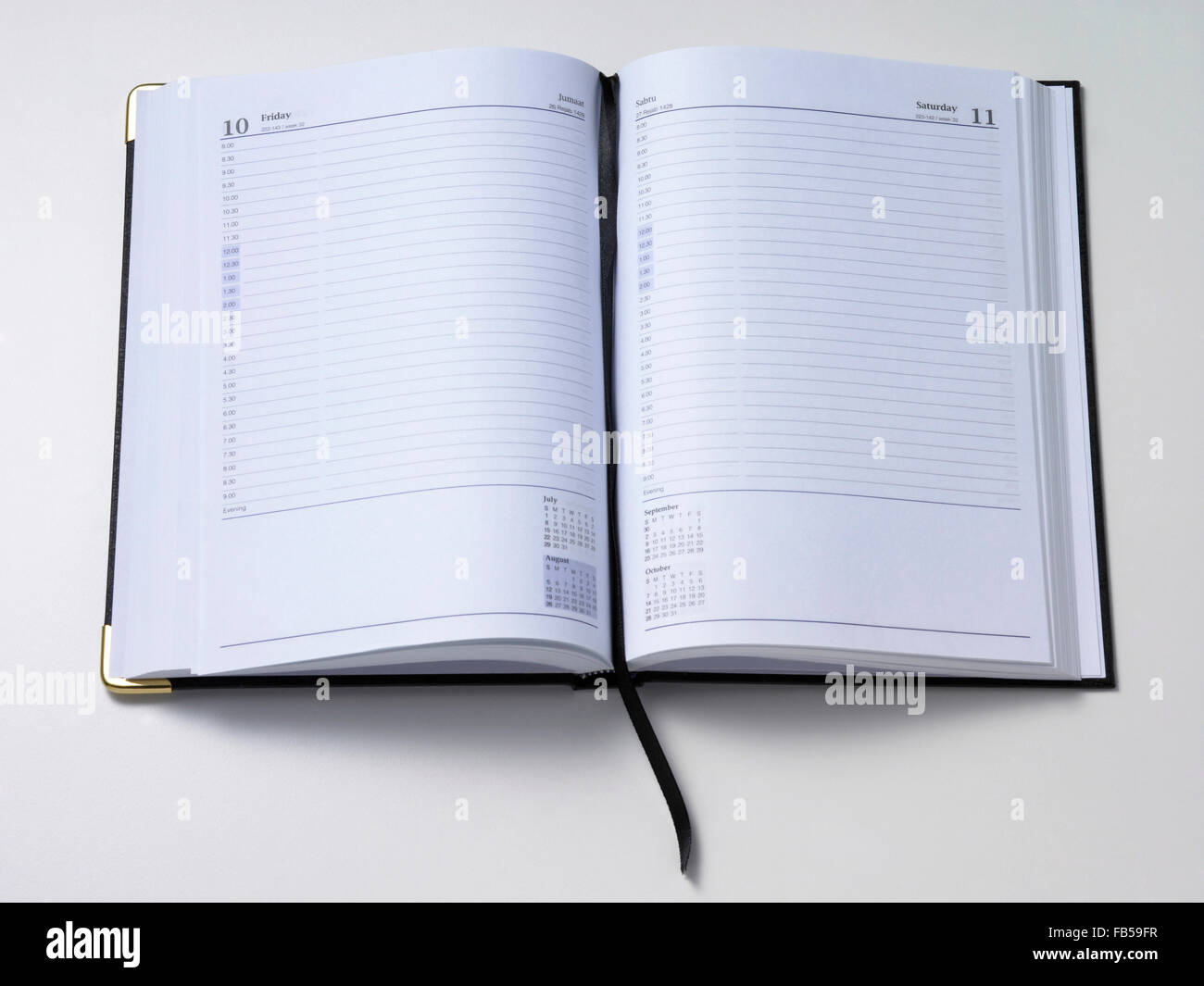 blank dairy with ribbon open on white background Stock Photo - Alamy