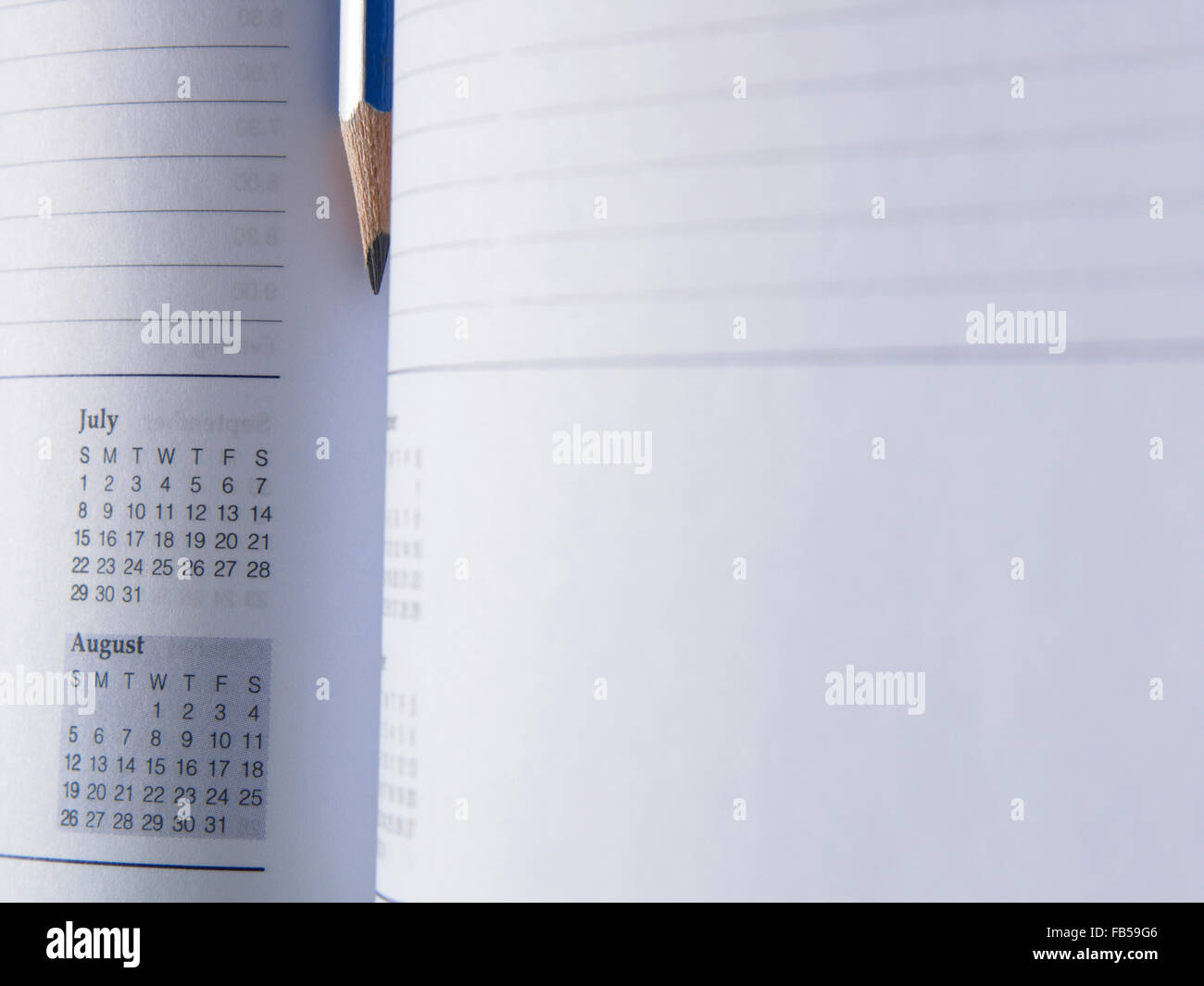 pen as book mark on the dairy Stock Photo - Alamy