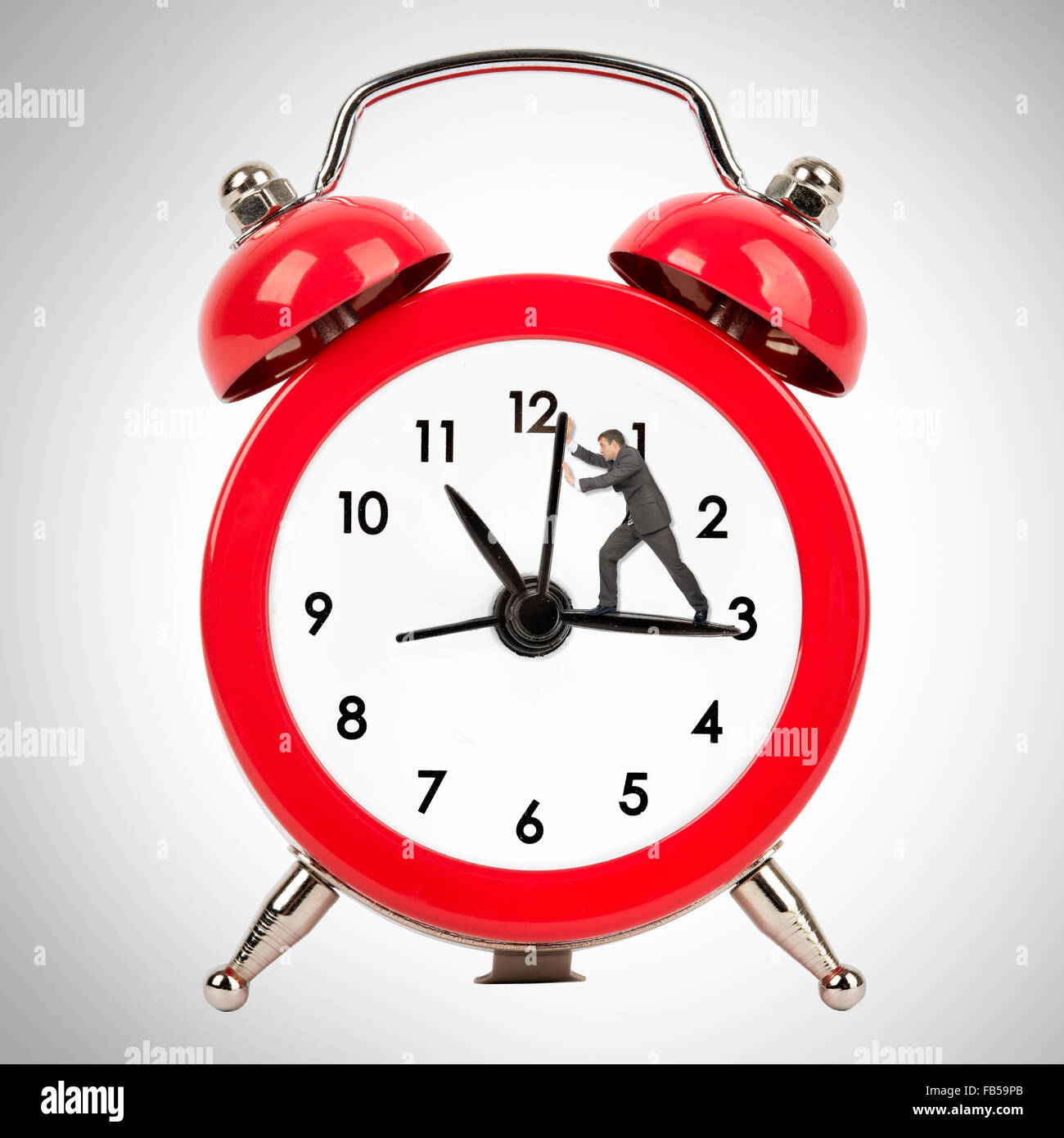 Businessman pushing clock hand Stock Photo - Alamy
