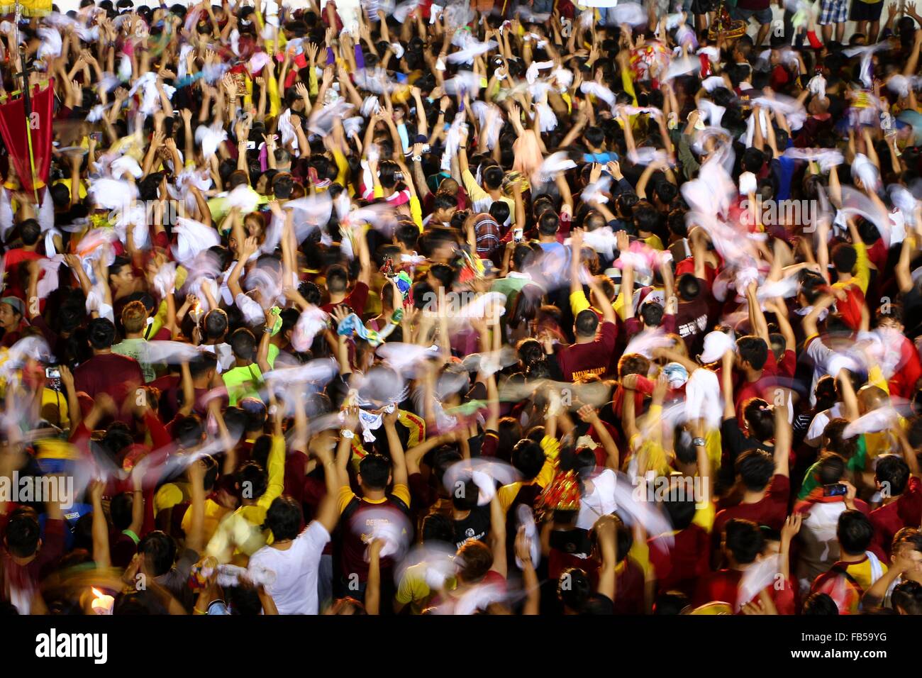 Manila, Philippines. 10th Jan, 2016. Devotees wave their towel while ...