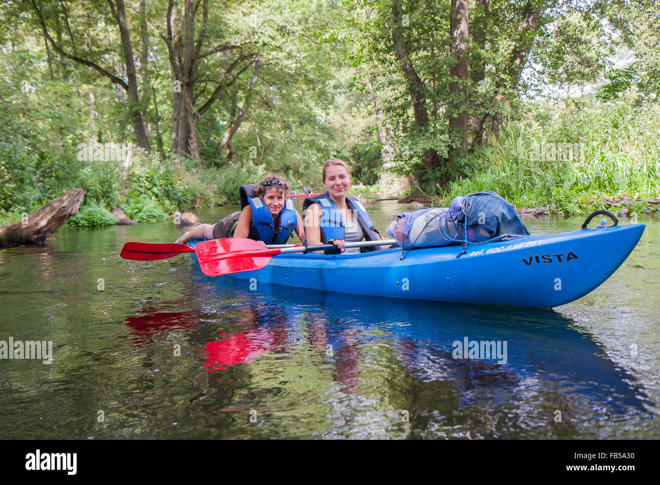 Woman canoeing down river hi-res stock photography and images - Alamy