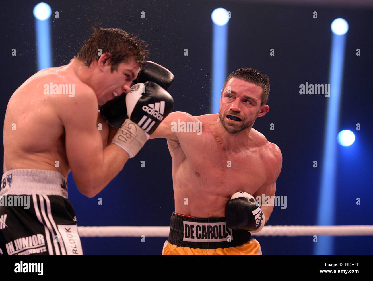 Offenburg, Germany. 9th Jan, 2016. Boxing pros Vincent Feigenbutz (l ...