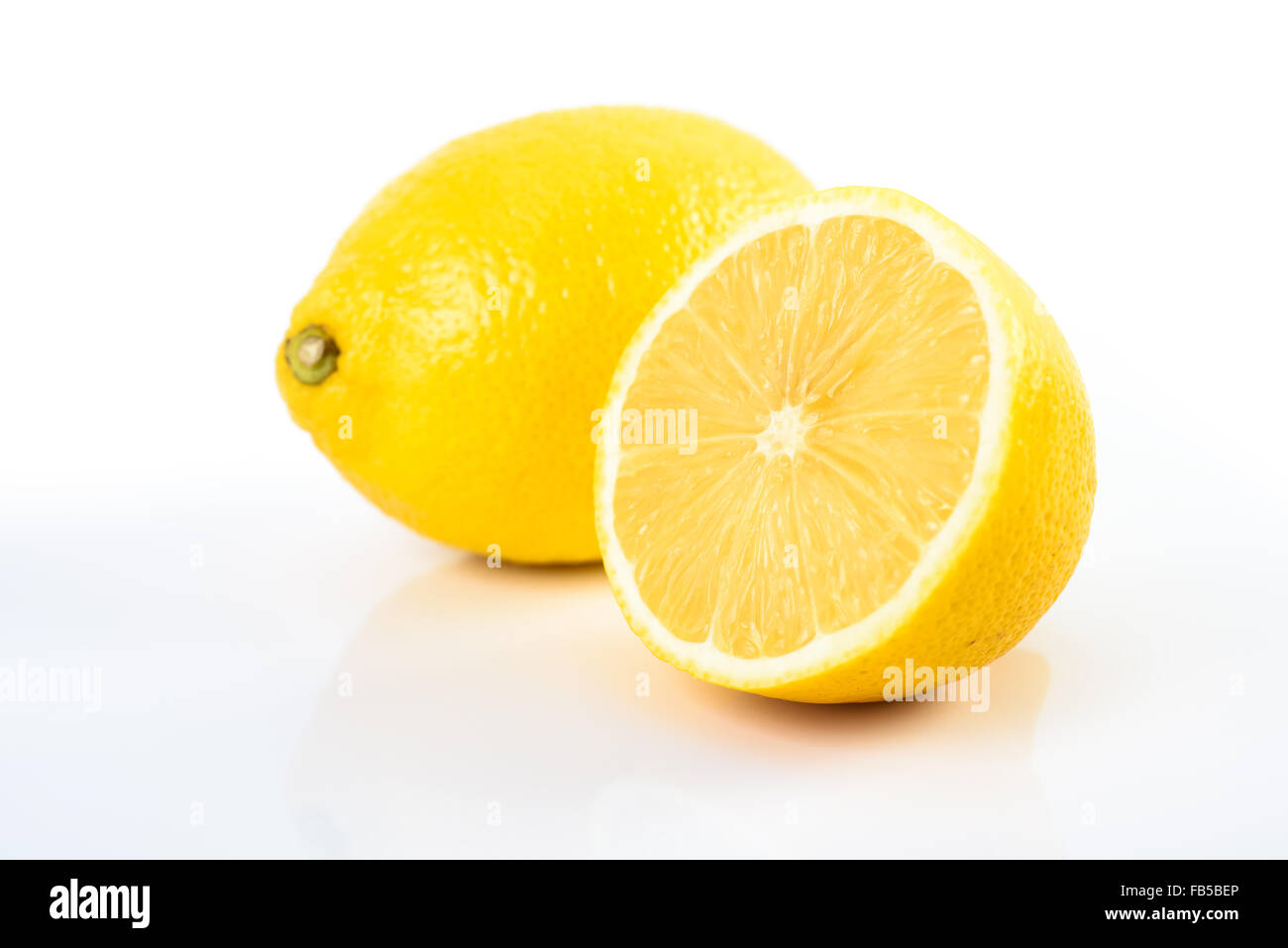 Fresh Yellow Lemons On White Stock Photo - Alamy