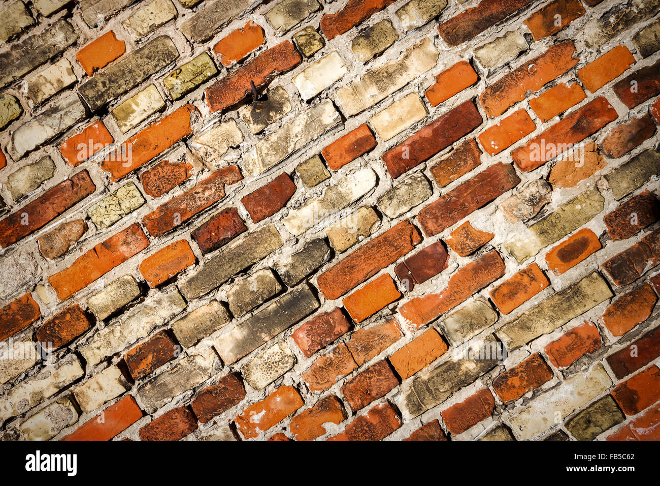 Background of yellow and red brick wall texture Stock Photo - Alamy