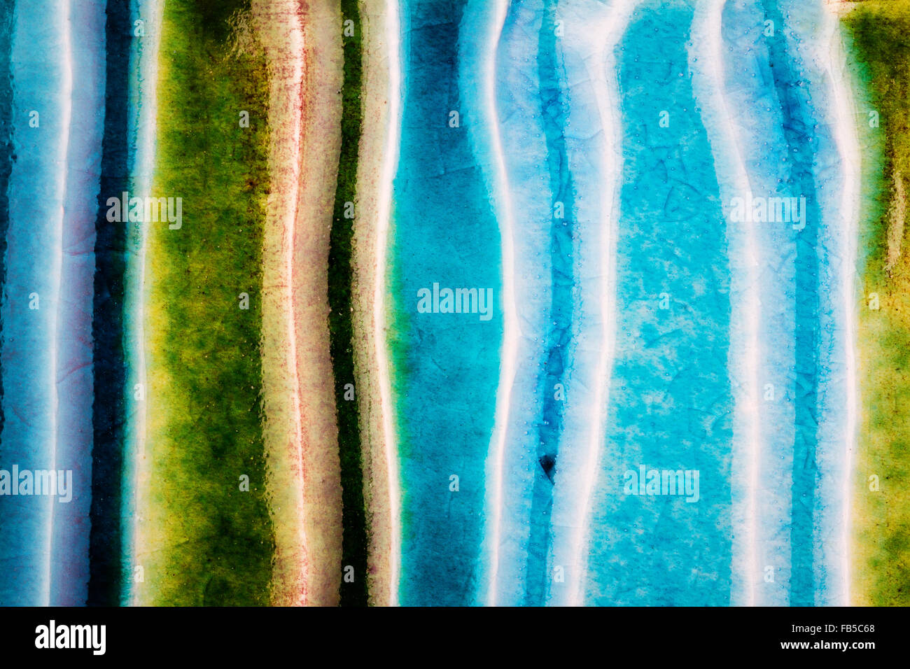Closeup shot of glazed green and blue ceramics texture Stock Photo - Alamy