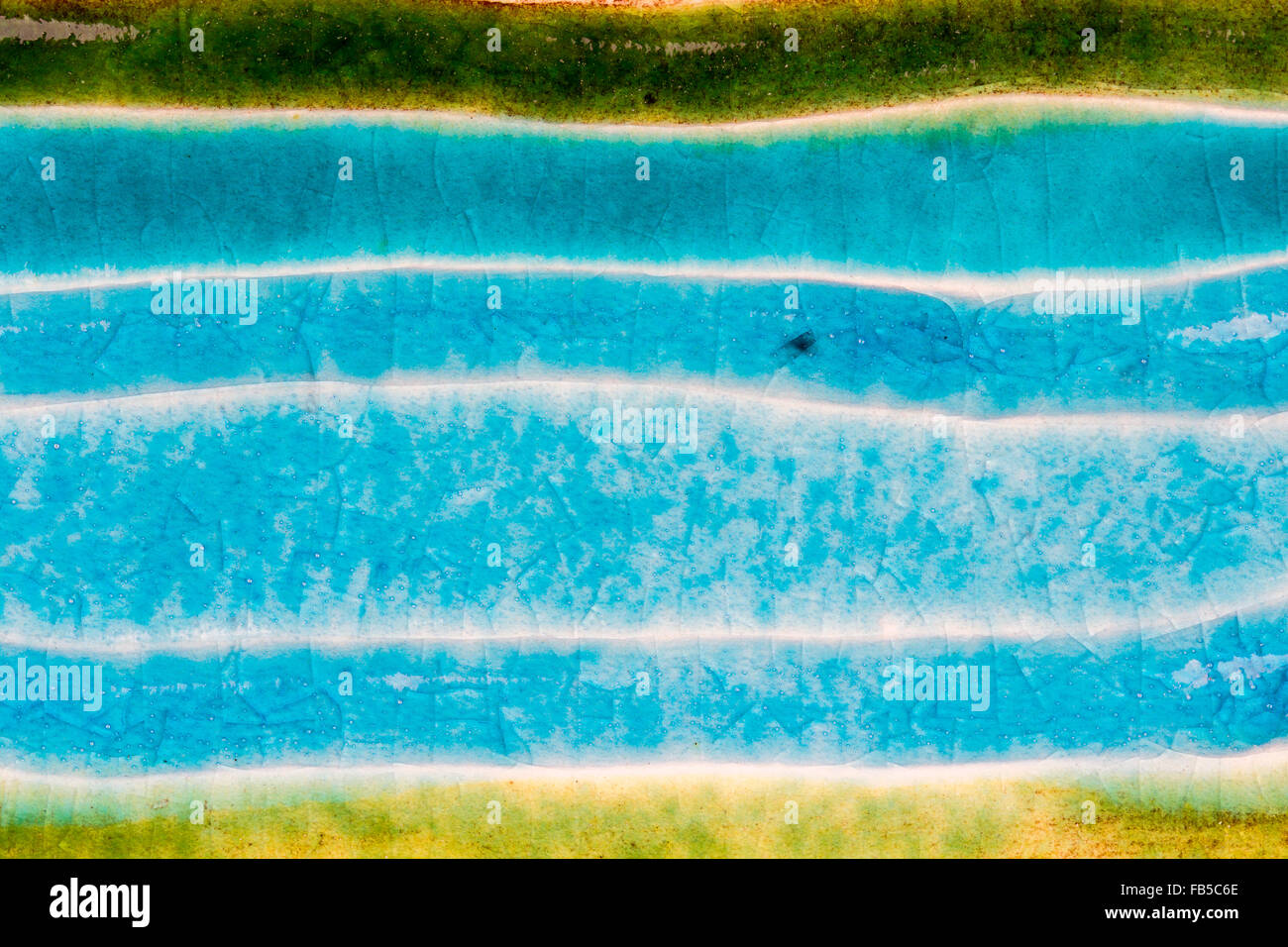 Closeup shot of glazed green and blue ceramics texture Stock Photo - Alamy