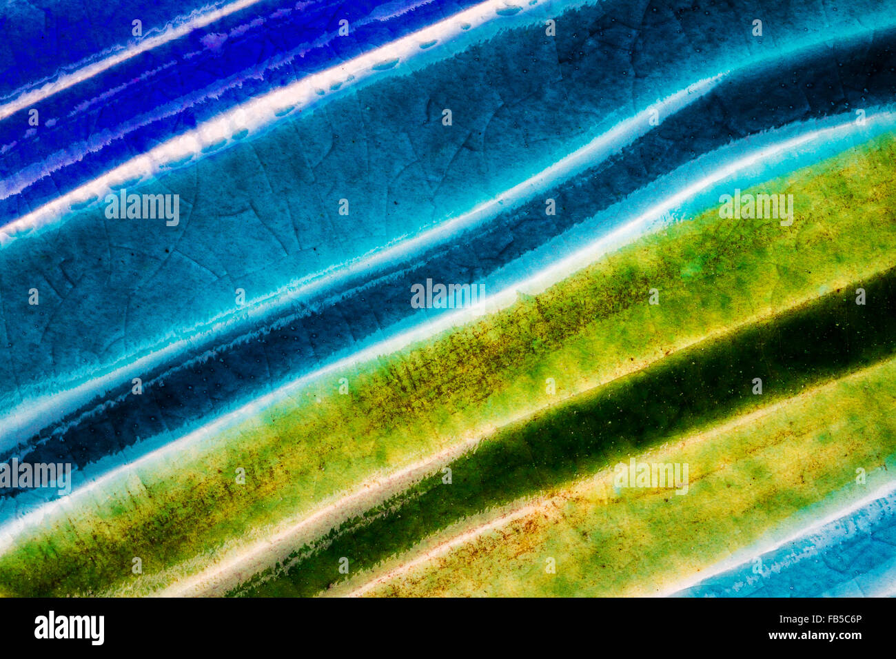 Closeup shot of glazed green and blue ceramics texture Stock Photo - Alamy
