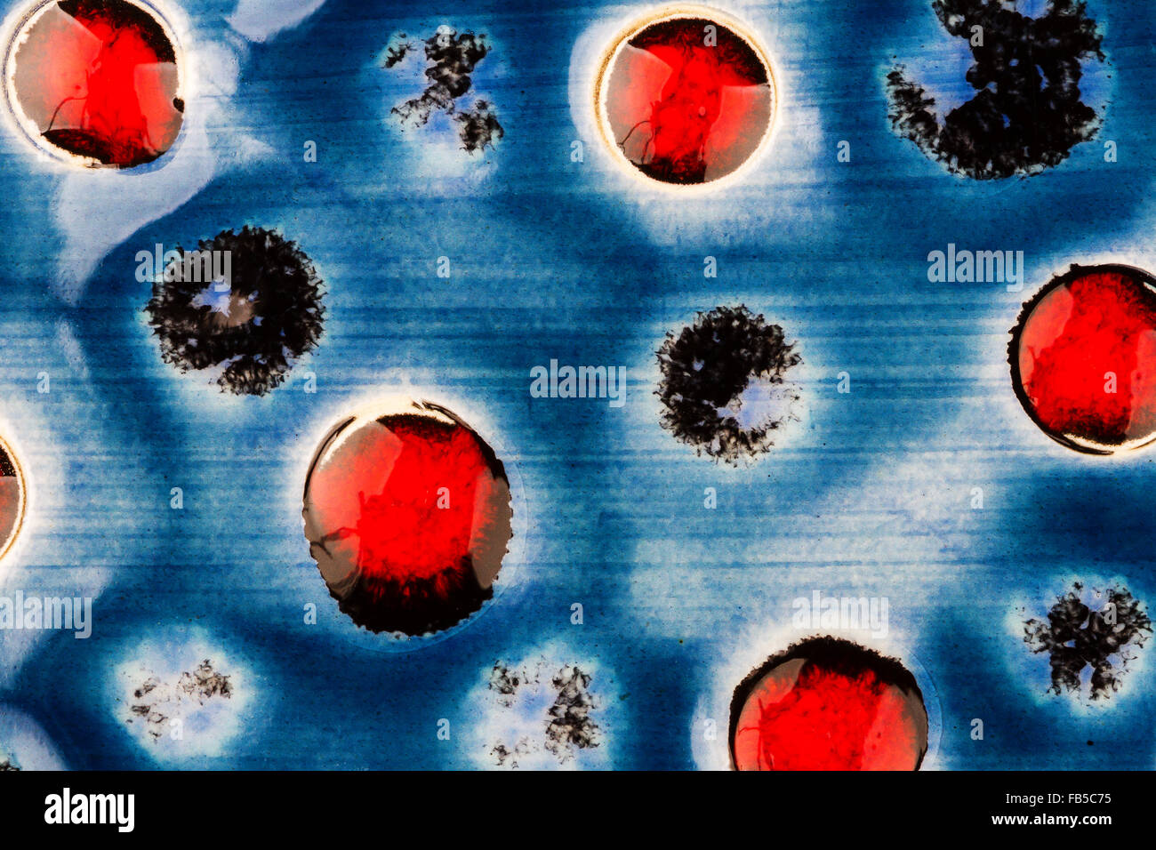 Closeup shot of glazed blue with red dots ceramics texture Stock Photo ...