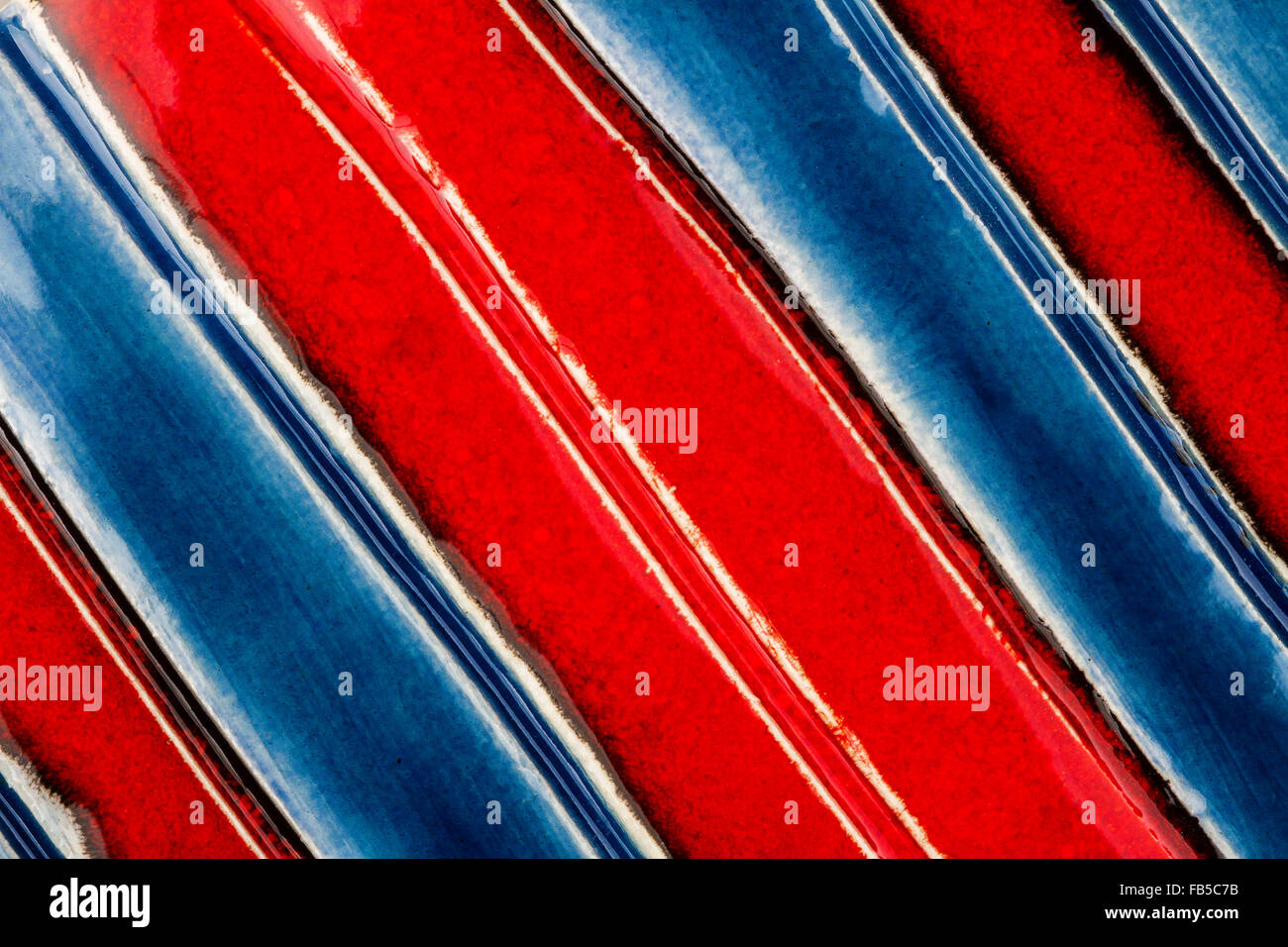 Closeup shot of glazed red and blue ceramics texture Stock Photo - Alamy