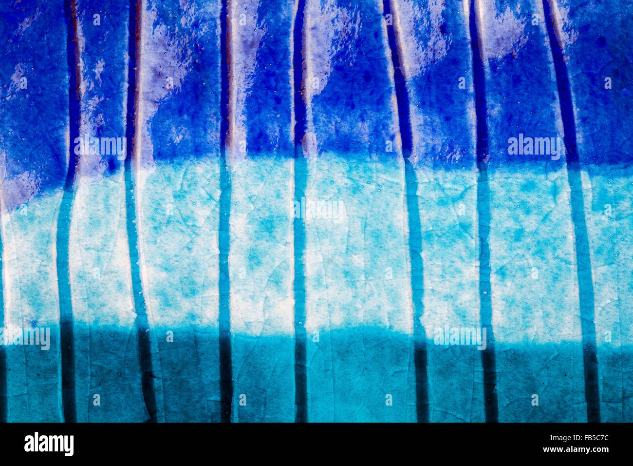 Closeup shot of glazed lined blue ceramics texture Stock Photo - Alamy